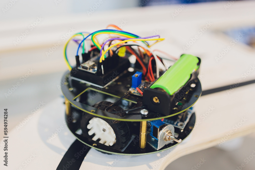 Homemade robot on wheels with eyes. Hobby robotics. Stock Photo | Adobe ...