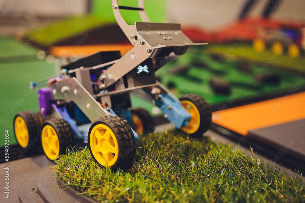 Homemade robot on wheels with eyes. Hobby robotics. Stock Photo | Adobe ...