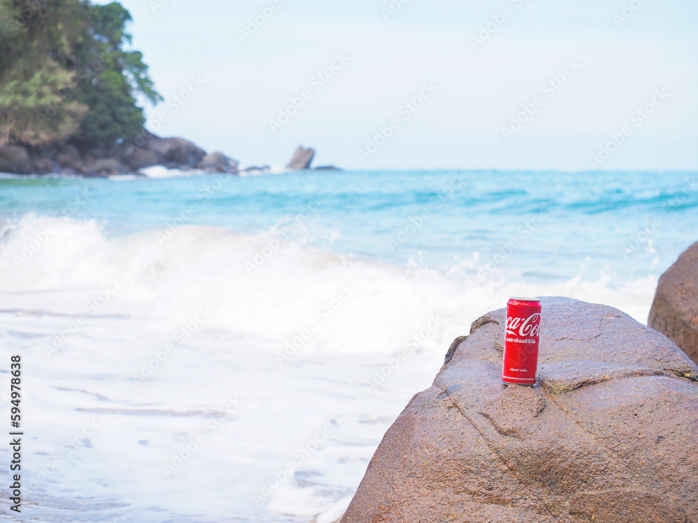 Coca-Cola can soft drink on the rock at summer beach background. Stock ...