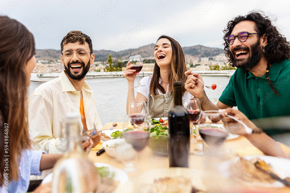 Hipster group of young friends eating and drinking at home terrace ...