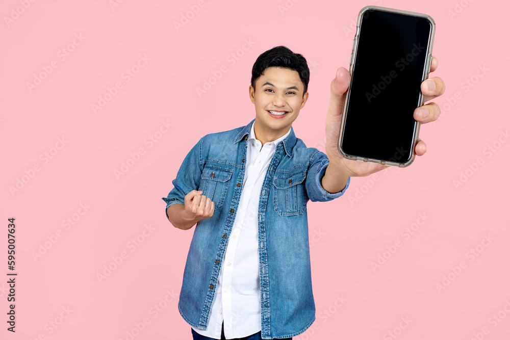 Cheerfull Asian man jumping and smiling in air with showing cellphone ...