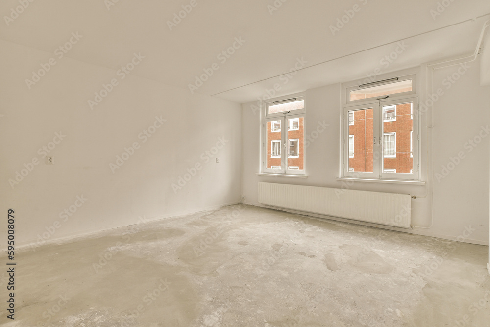 an empty room with white walls and no one person standing in the corner ...