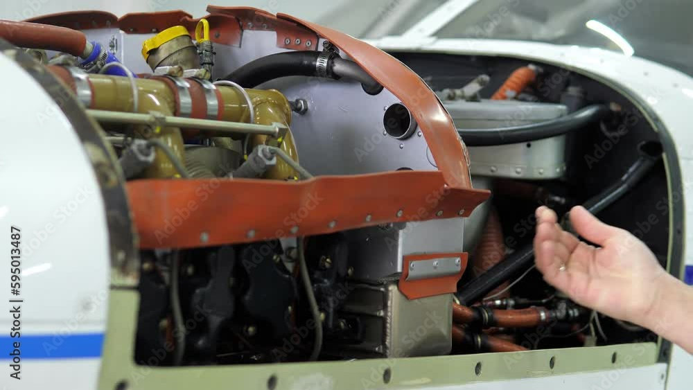 Single engine propeller airplanes parked in a closed aircraft hangar ...