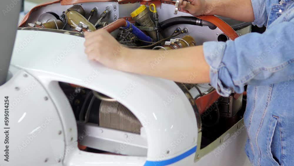 Single engine propeller airplanes parked in a closed aircraft hangar ...