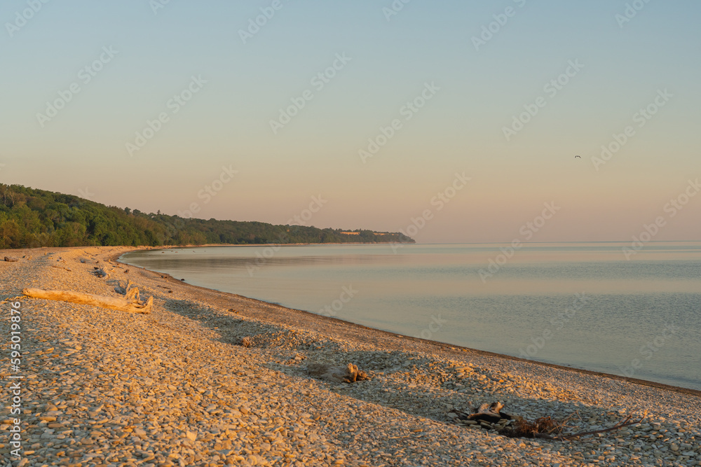 Pebble beach in Toila oru, Estonia. A sunny evening on the coast of the ...
