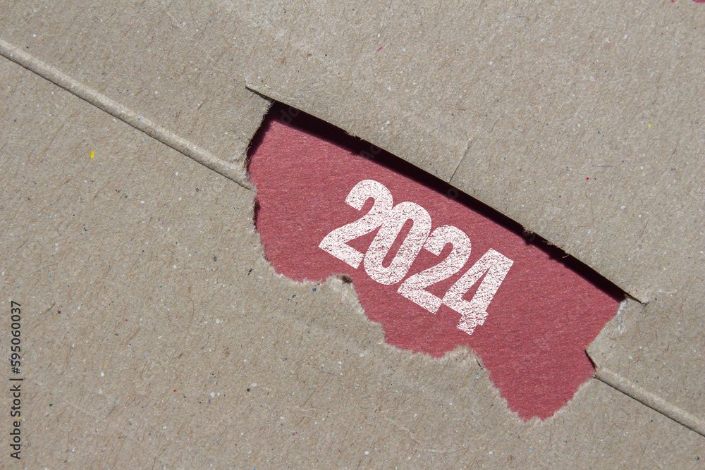 2024 written on ripped paper. New year 2024 concept photo. Stock Photo ...