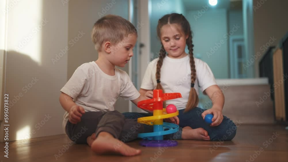 children baby play together toys in kindergarten. happy family ...