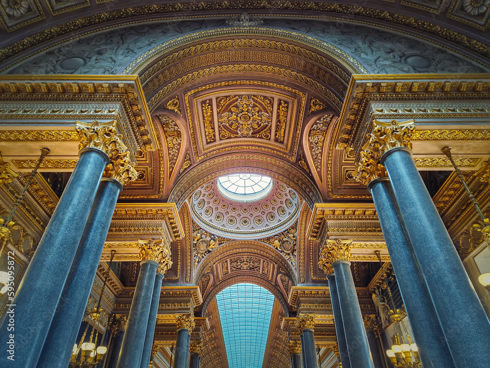 Ceiling architectural details with the glass dome and golden ornaments ...