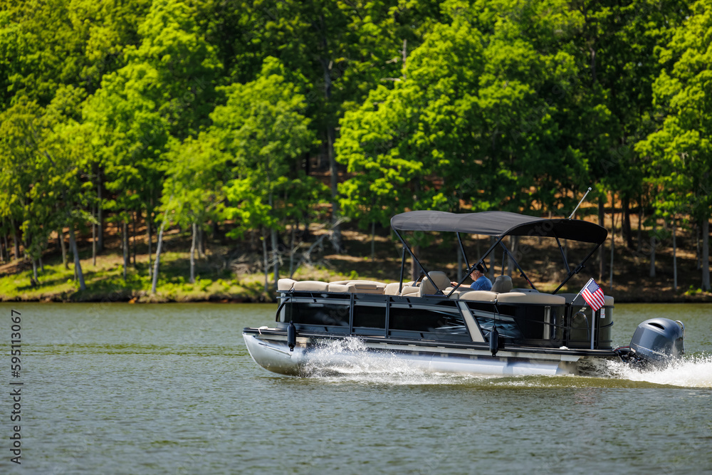 Boater on pontoon boat enjoying summer day on Lake. Pontoon party boat ...