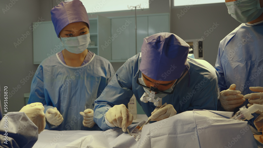 Doctor using tools at operation room. doctor took knife down cut chest ...