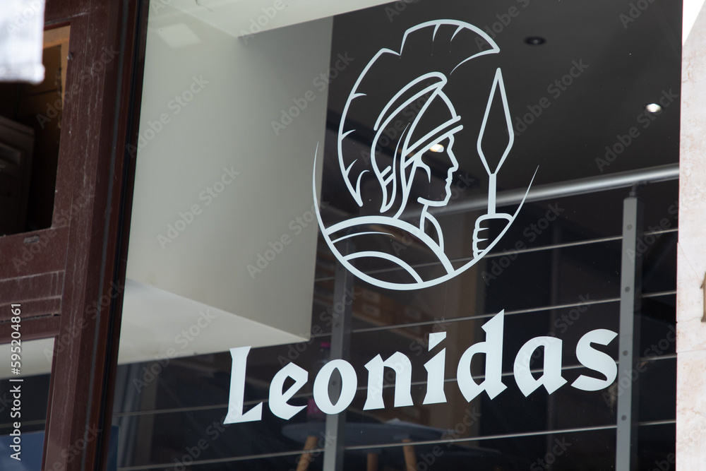 Leonidas logo brand and sign text wall windows facade shop entrance of ...