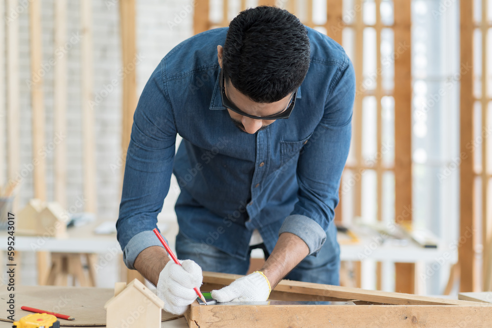 Professional male carpenter using measuring tool, metal square ...