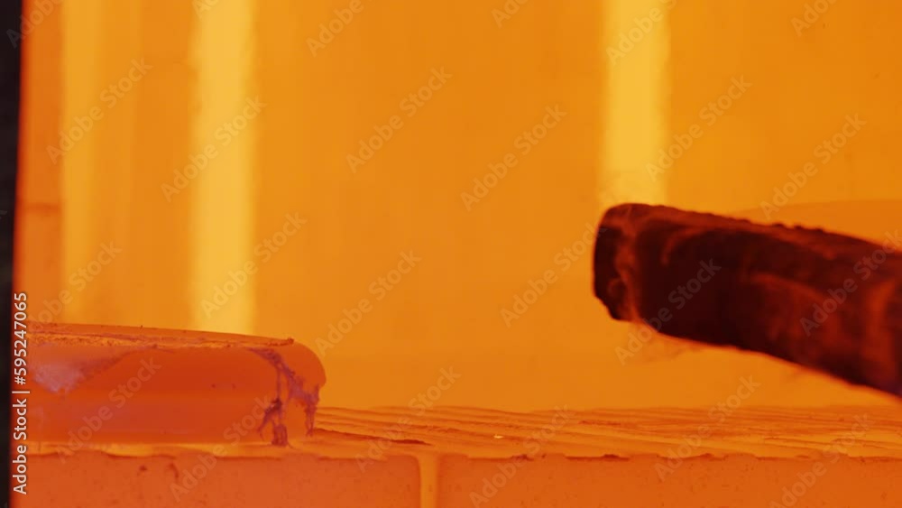 Metal parts inside an industrial furnace during forging process ...