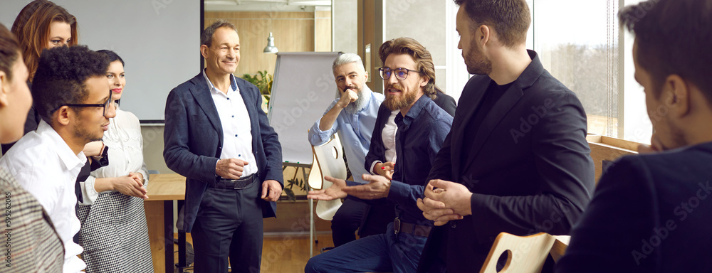 Team of smart business people have fun talking and discussing work ...