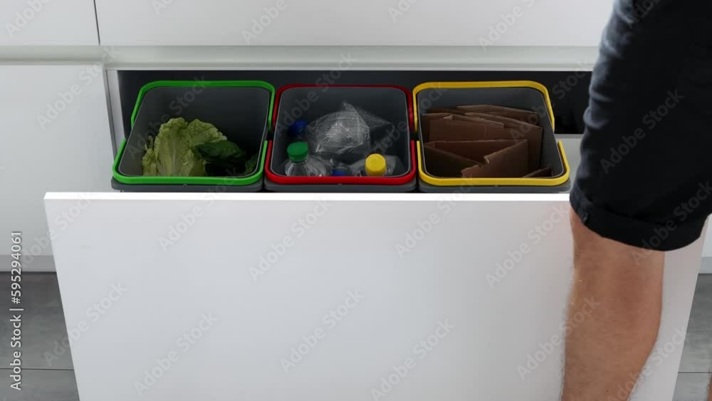 Colorful bins for sorting of plastic, paper garbage and organic waste ...