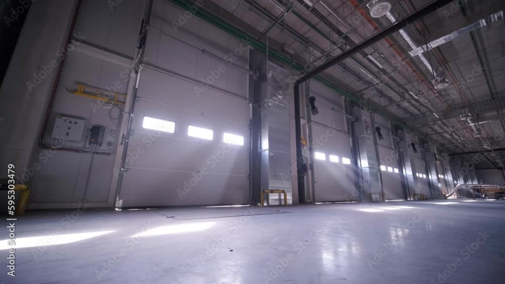 Video „There are automatic gates at a large warehouse. The gates are ...