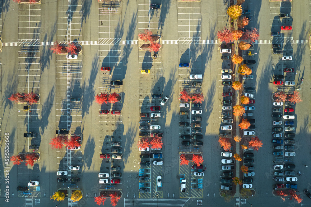 View from above of many parked cars on parking lot with lines and ...