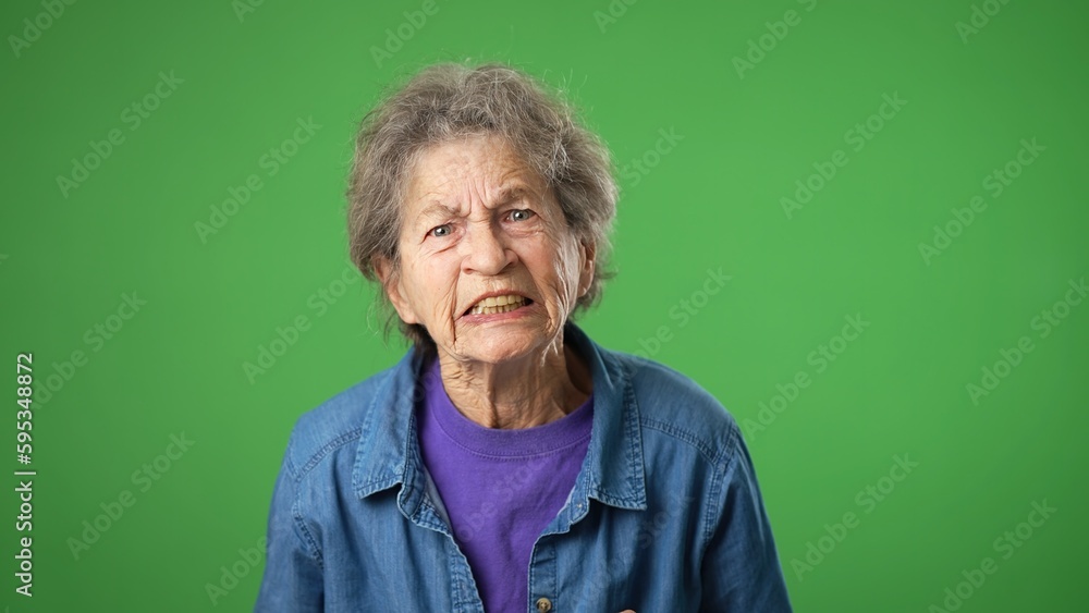 Portrait of angry upset frustrated elderly senior old woman with ...