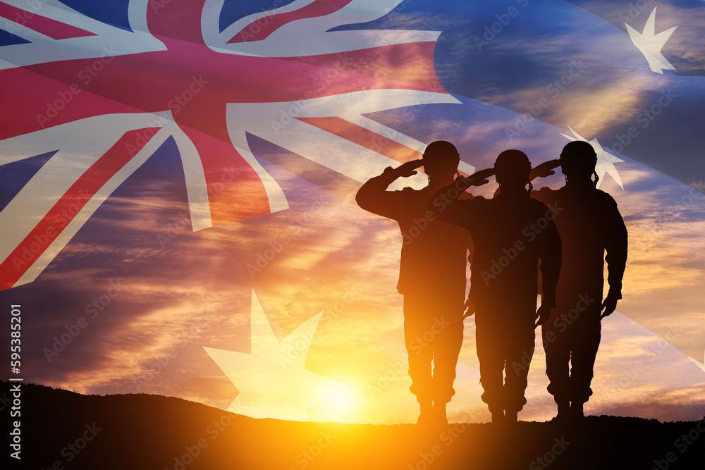 Silhouettes of soldiers saluting on background of Australia flag and ...