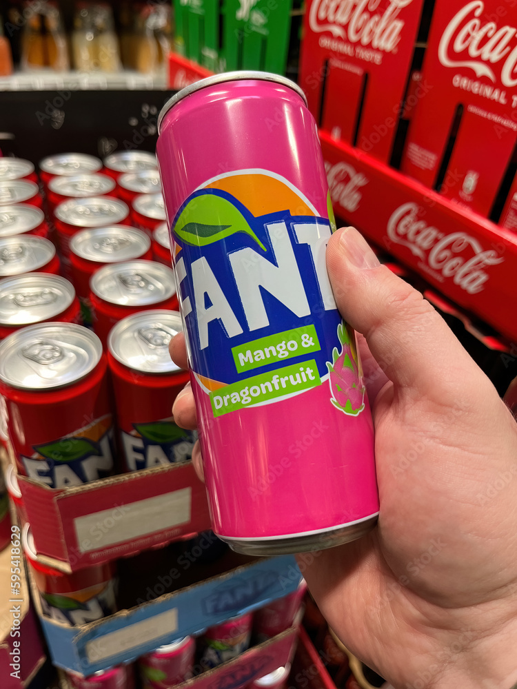 GERMANY - APR 22, 2023: A man’s hand holding a chilled can of Fanta ...