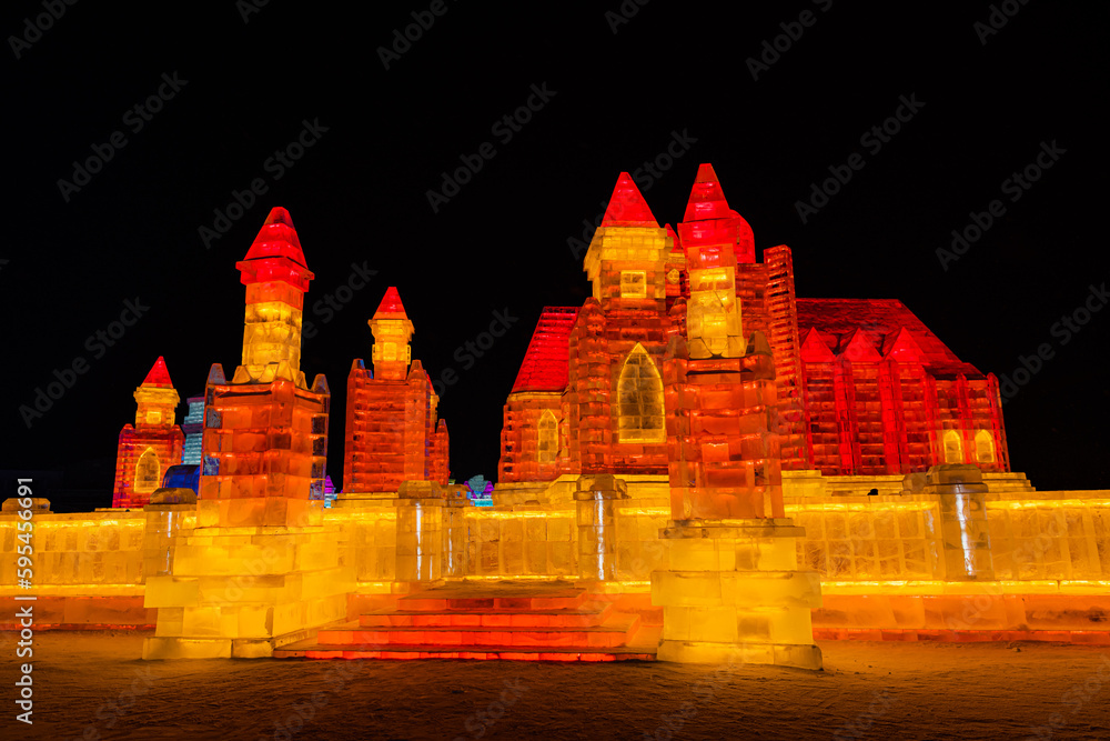 Foto de January, 1st, Harbin, China. Red and yellow towers of the ice ...