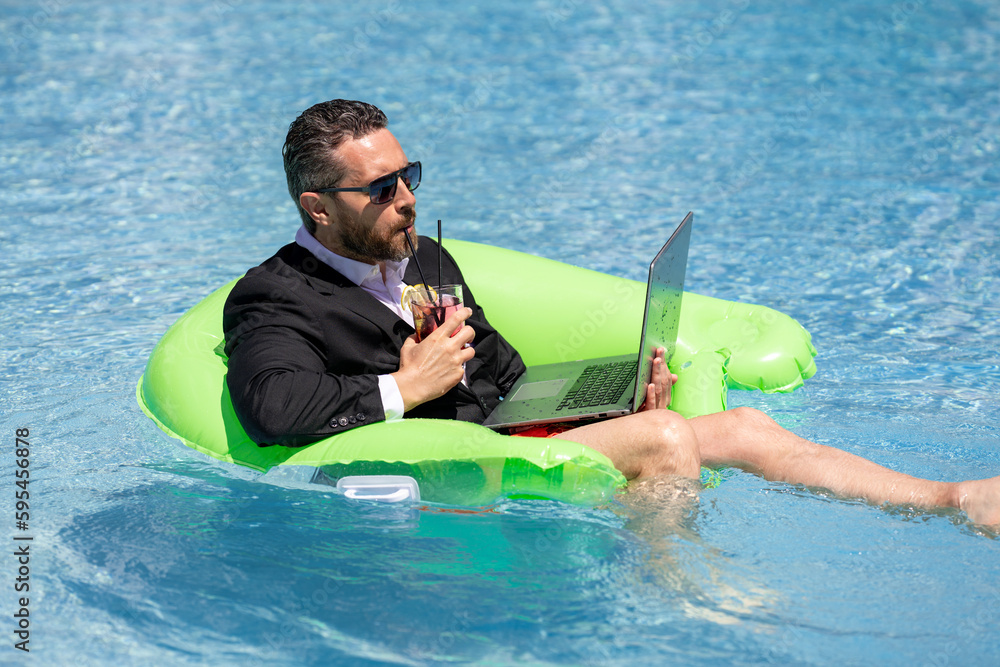 Summer business dreams. Business man in suit floating with cocktail and ...