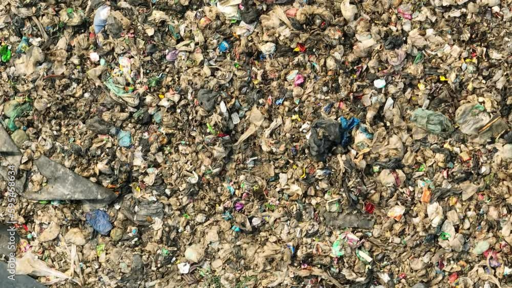 As more waste is deposited in the landfill, the garbage pile grows in ...