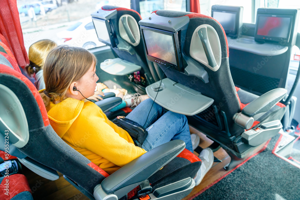Bus road traveling. Girl kid rides on large comfortable sightseeing ...
