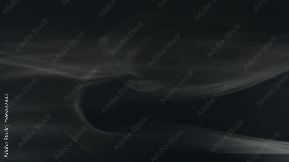 Smoke from left to right and right to left. Cloud of cold fog on black ...