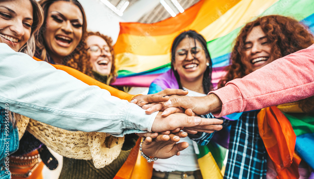 Lgbt group of people stacking hands outside - Diverse happy friends ...