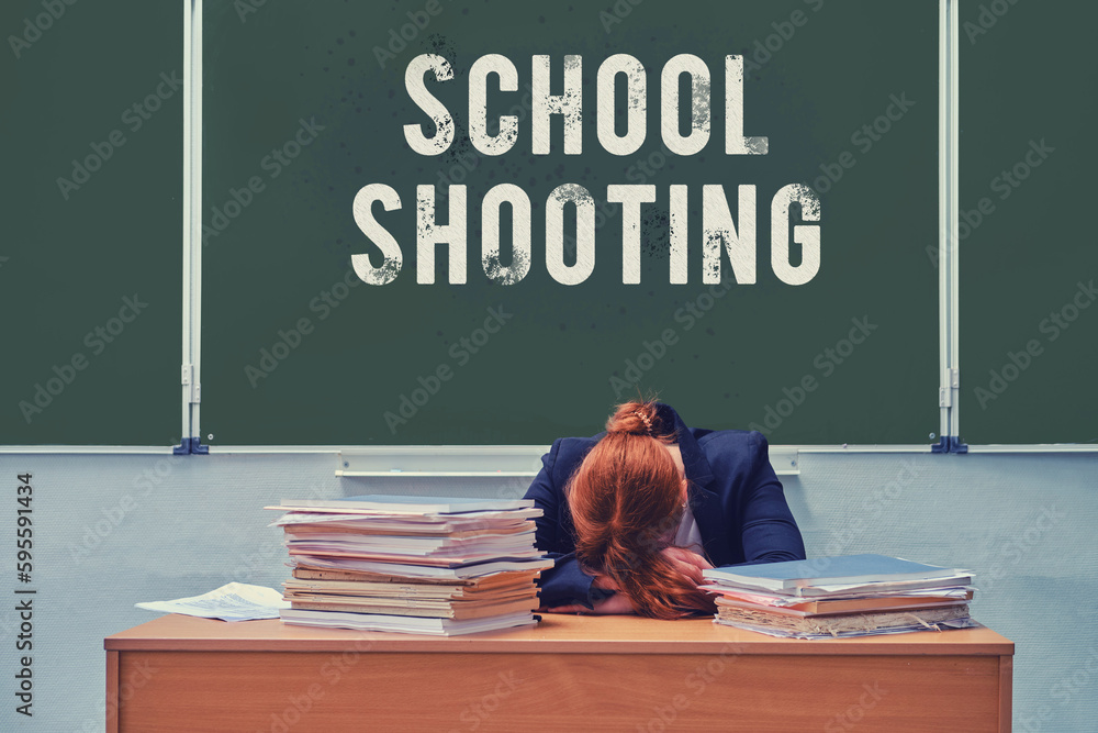 Text school shooting on the blackboard and sad teacher in the classroom ...
