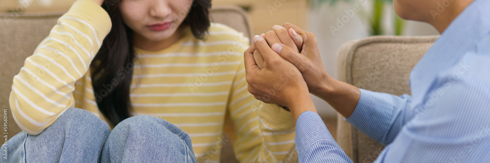 Female psychologist touching hands to comforting and encourage stress ...