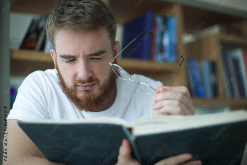 tired overworked guy, exhausted young man in glasses college or ...