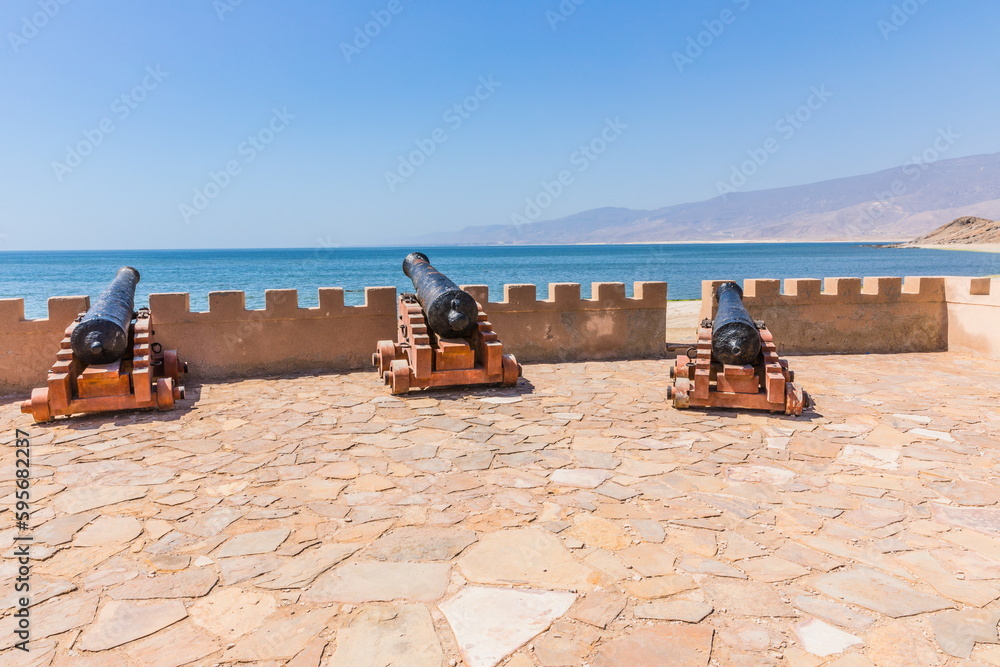 Cannons near Mirbat castle near the sea in Mirbat town, Sultanate of ...