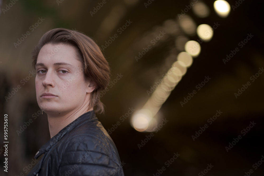 A genderfluid (LGBTQ) model poses outside, in front of a tunnel, to ...