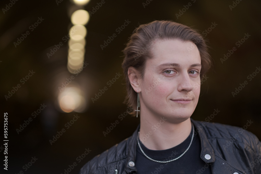 A genderfluid (LGBTQ) model poses outside, in front of a tunnel, to ...