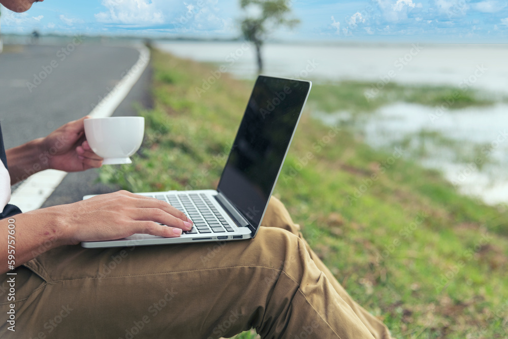 Man hands typing laptop notebook holding coffee cup outside office ...