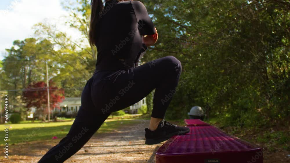 Stretching on a park bench, this leggy brunette athlete warms up her ...