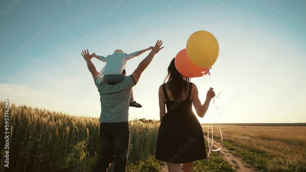 Video „Active happy family run together on wheat field. Enjoy summer ...