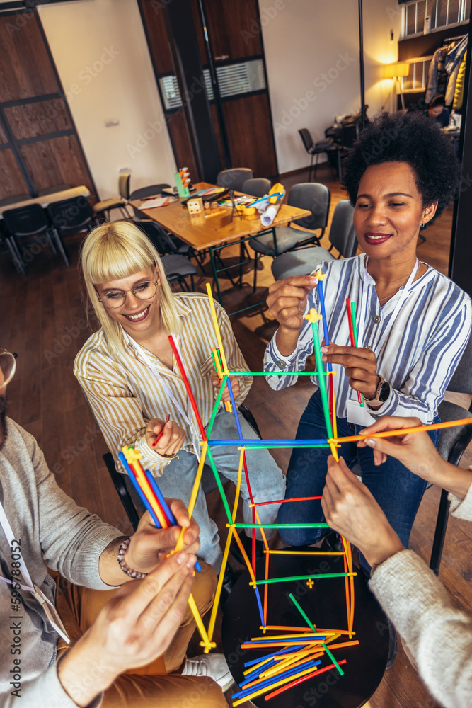 Team building activities in the office with sticks.Concept of ...