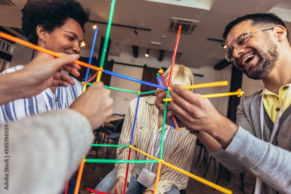 Team building activities in the office with sticks.Concept of ...