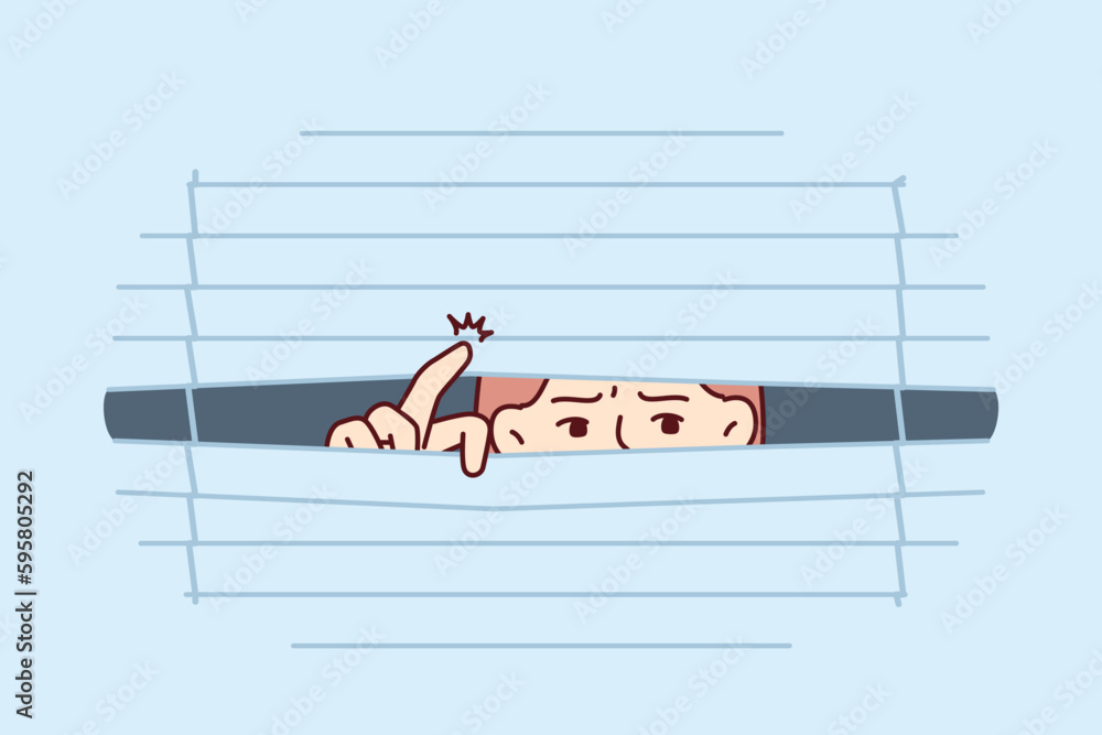 Suspicious man looks out window suffering from schizophrenia and ...