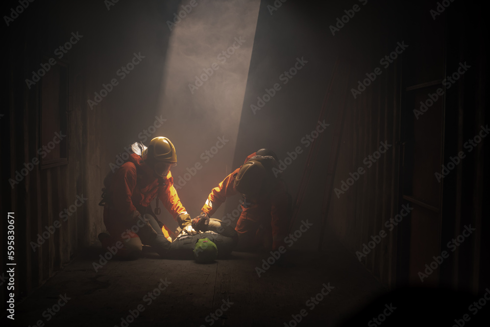 The two firefighters are diligently practicing their skills in a ...