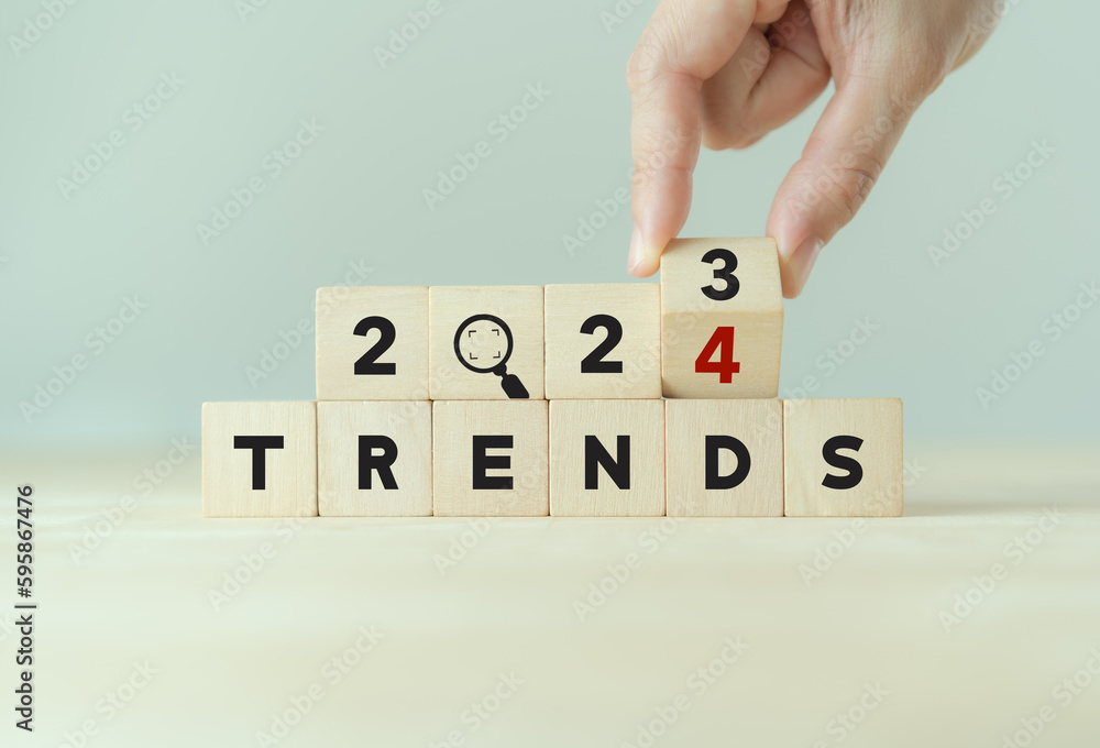 2024 trend concept. Hand flip wooden cube turn year 2023 to 2024 ...