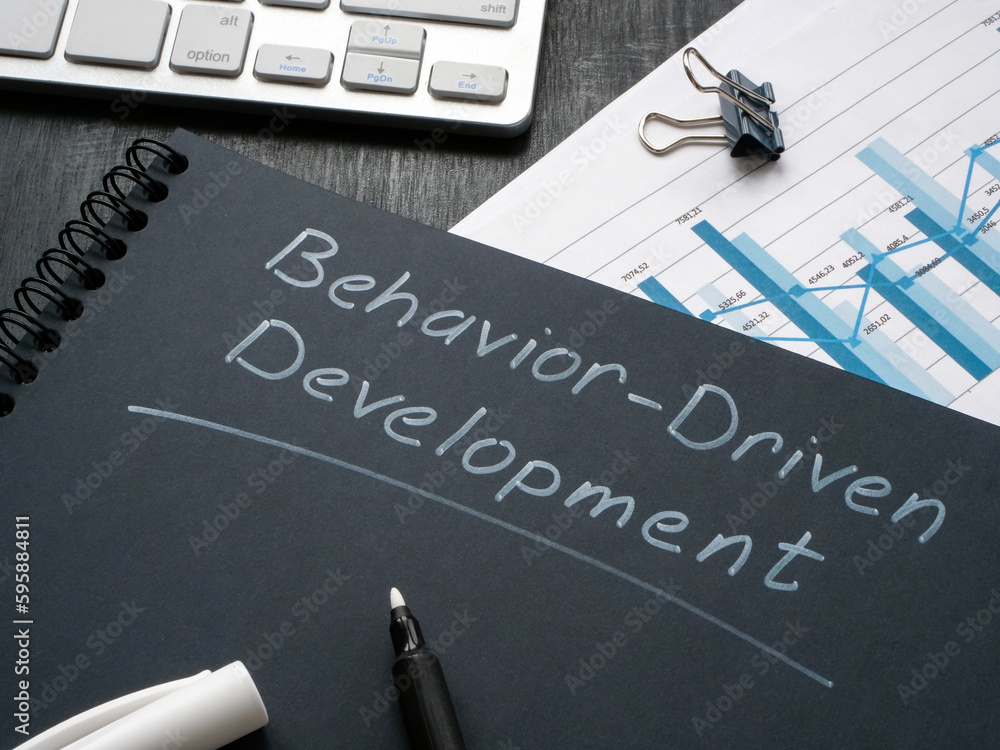 Desk with notepad and marks about behavior driven development BDD ...