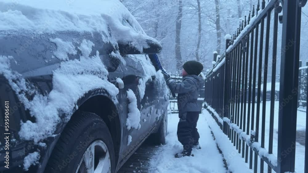little baby boy help father clean car covered white snow cleaning ...