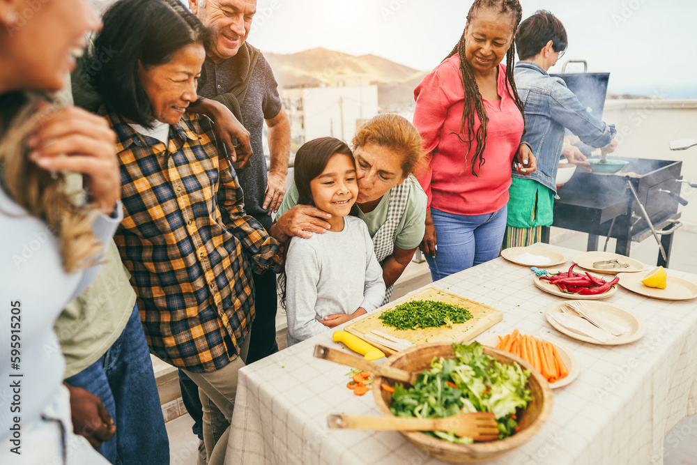Multi generational people doing barbecue at home's rooftop ...