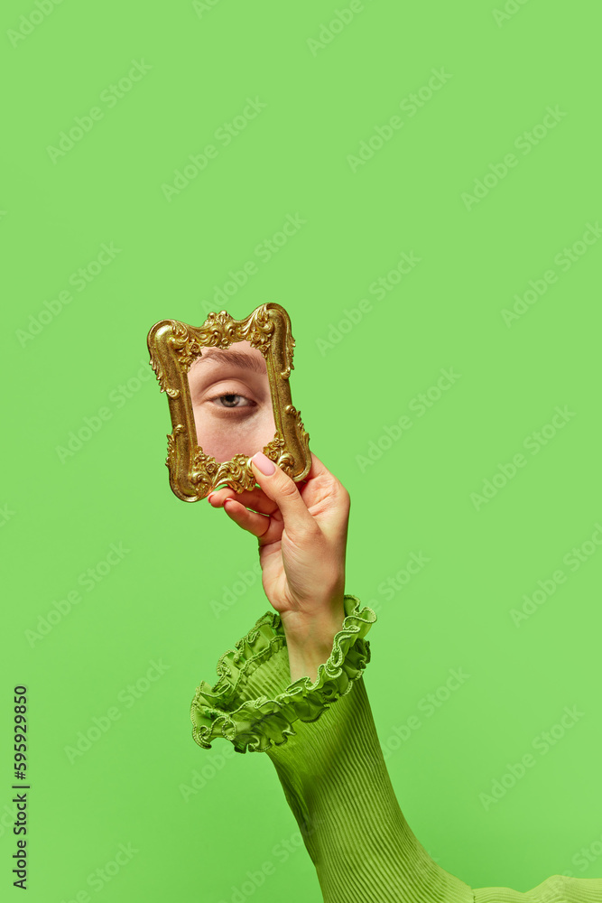 Vintage style. Female hand holding small mirror with reflection of sad ...