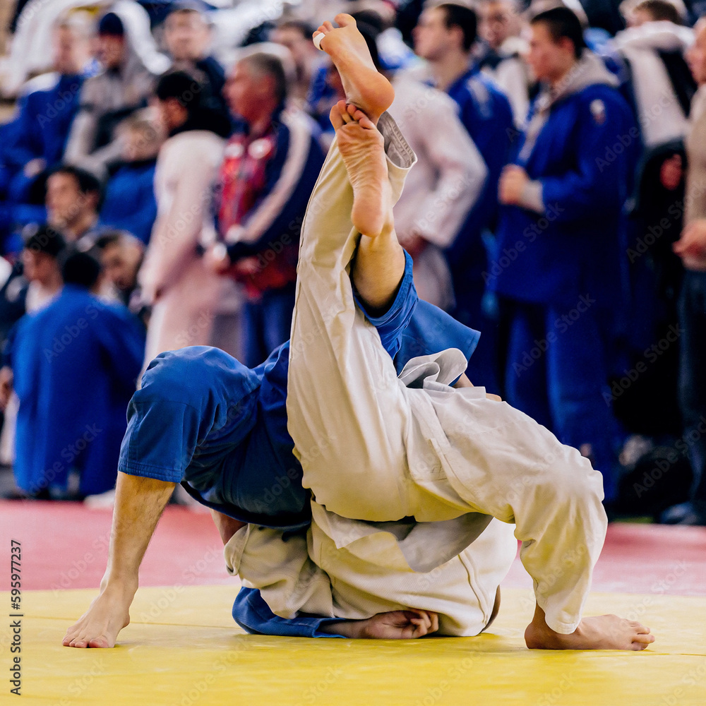 two judoists are lying on tatami in fight judo competition Stock Photo ...