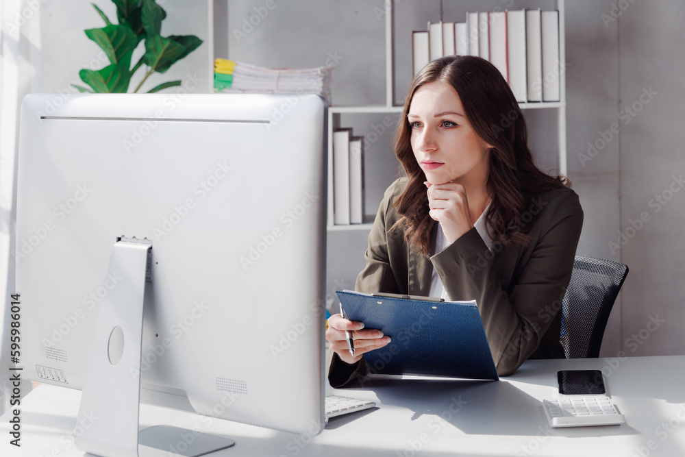 Business woman entrepreneur holding chart working with computer at ...